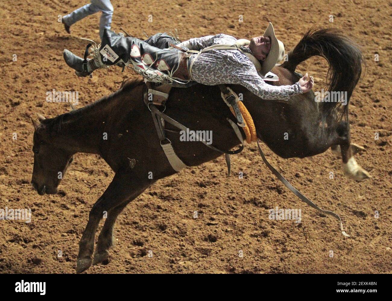Will Lowe rides Show Girl in the bareback bronc competition in the ...