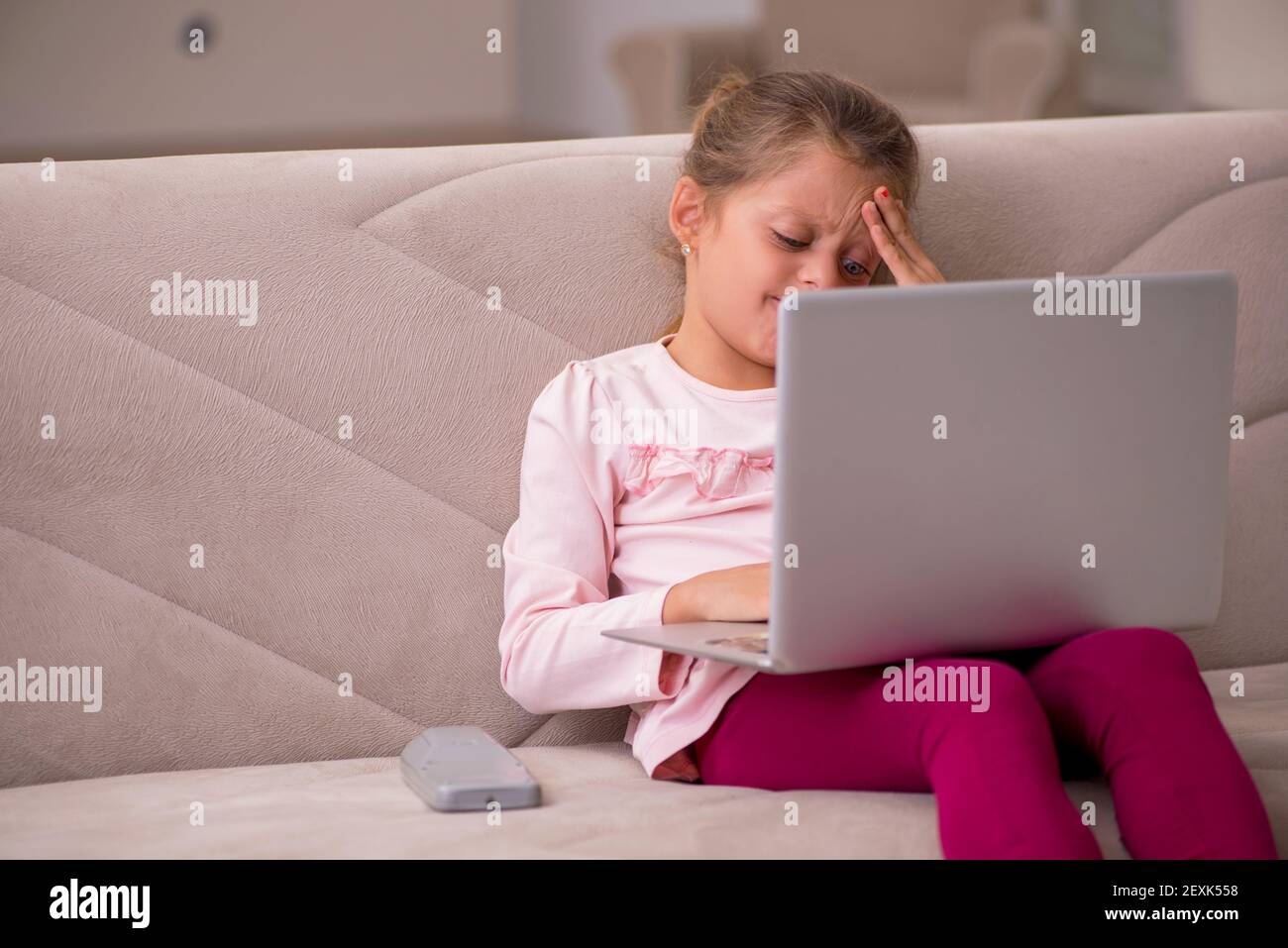 Little girl in tele-education concept at home Stock Photo - Alamy