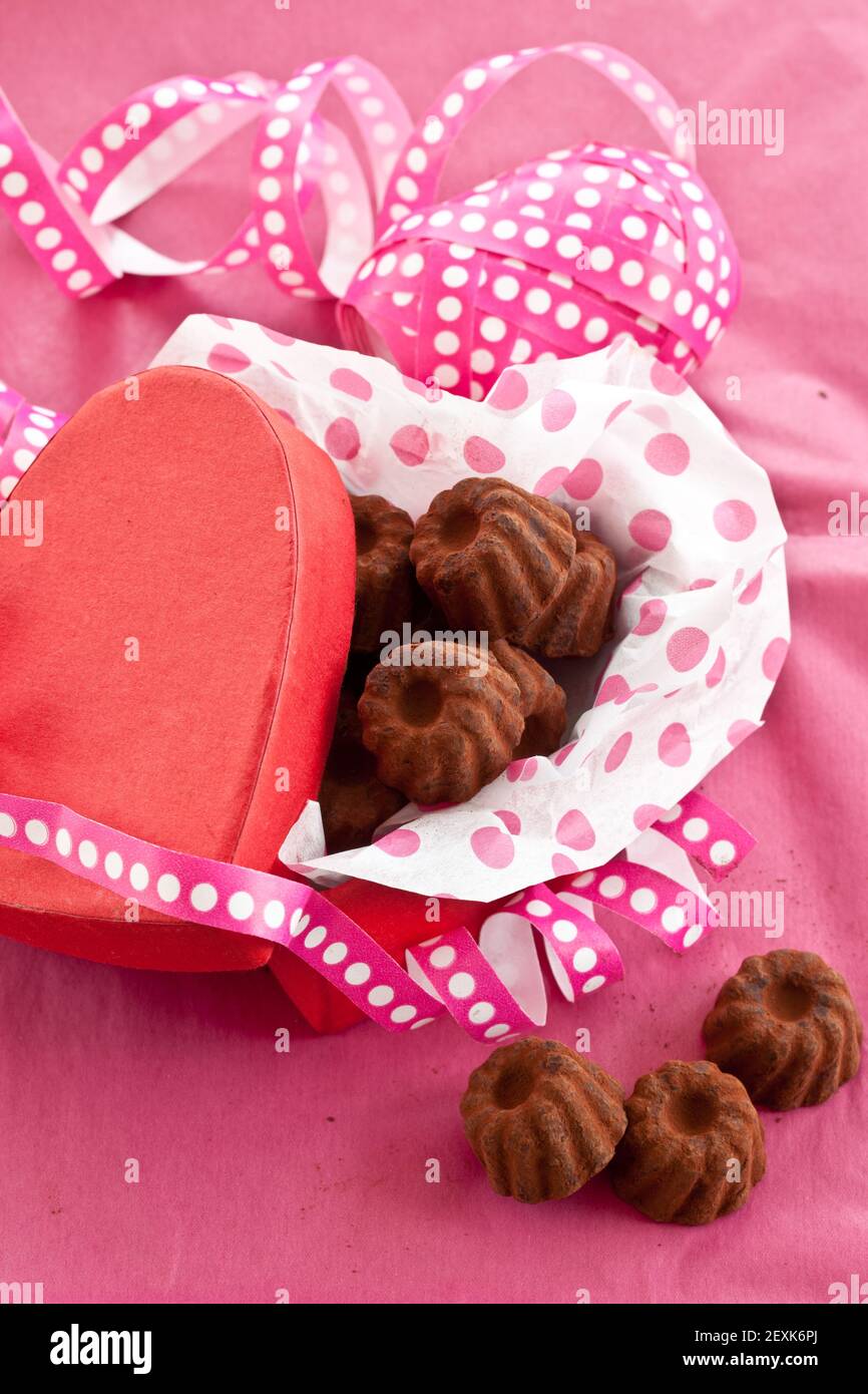 Small chocolates in heart box Stock Photo - Alamy