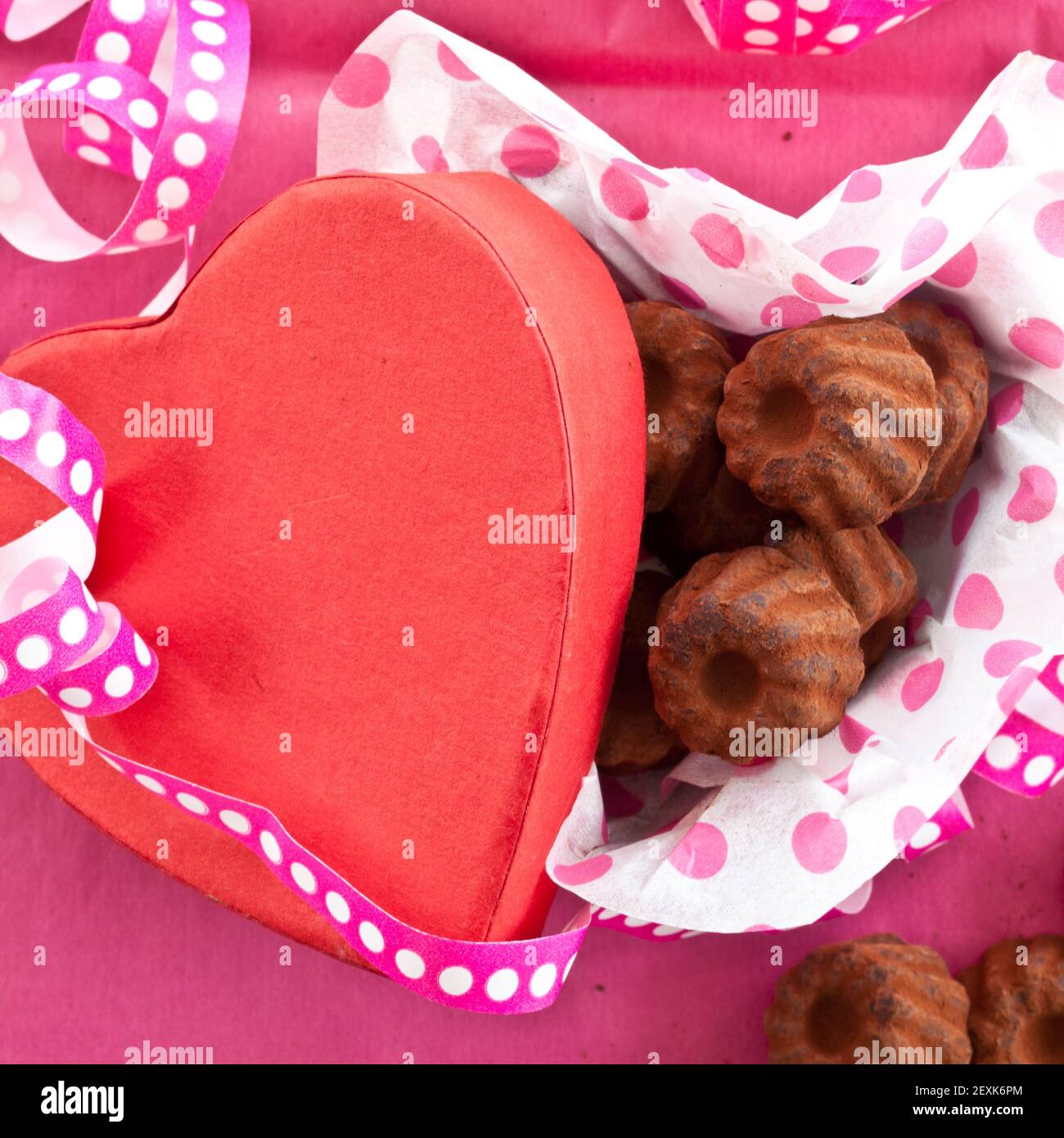 Small chocolates in heart box Stock Photo - Alamy