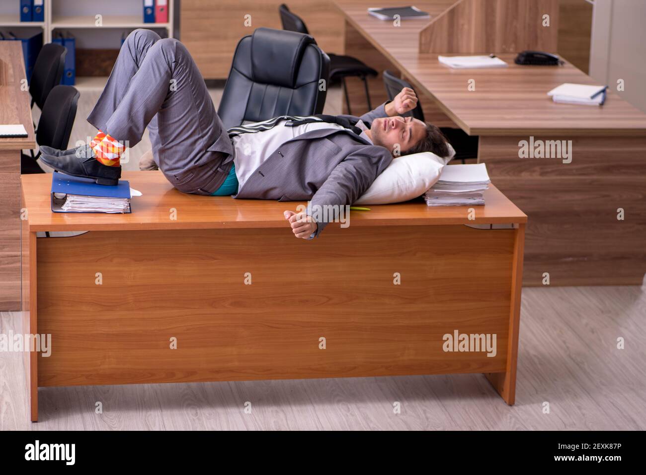 Funny man stretching desk hi-res stock photography and images - Alamy