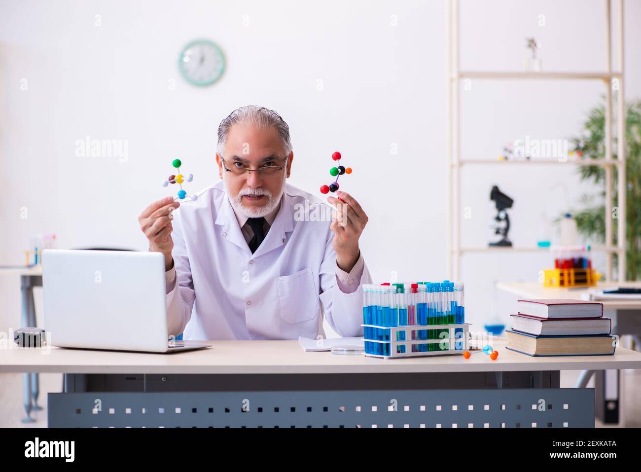 Senior male scientist studying molecular model Stock Photo - Alamy