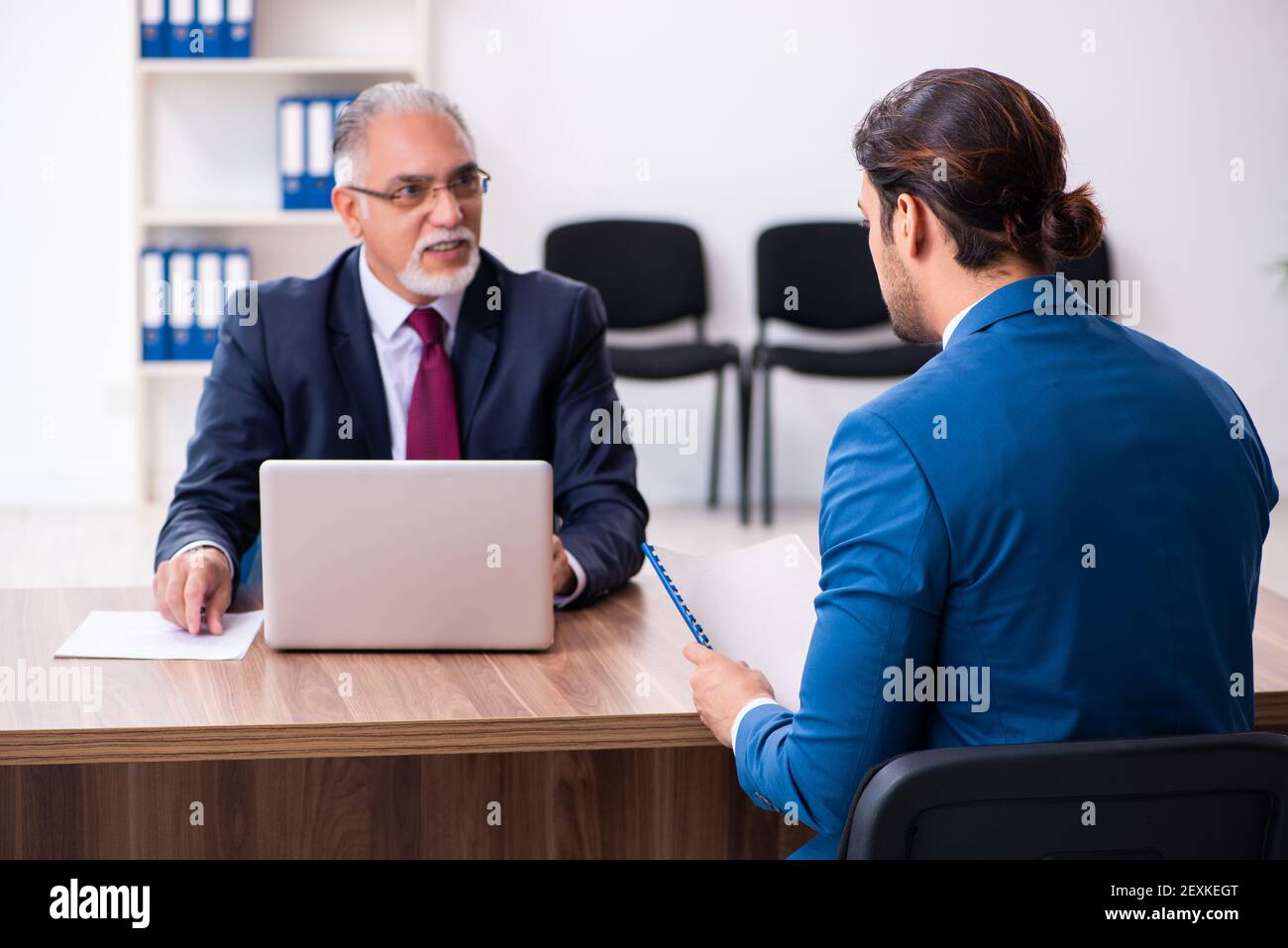 Male candidate employee meeting with old recruiter Stock Photo - Alamy