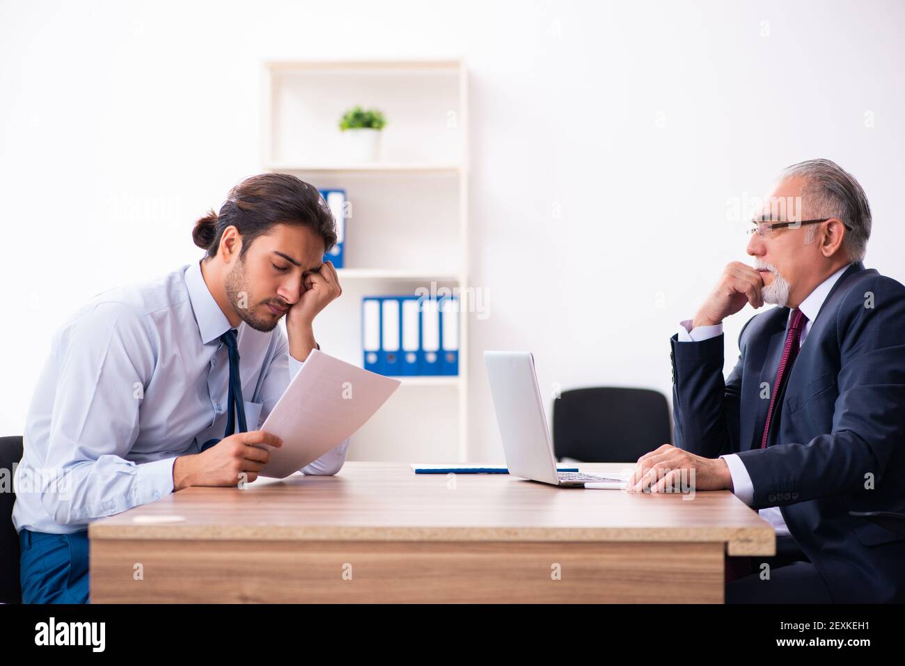 Male candidate employee meeting with old recruiter Stock Photo - Alamy