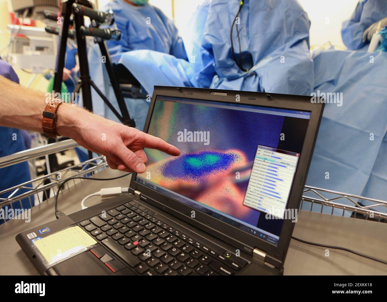 Ryan Fields, left, a Washington University oncological surgeon at the ...