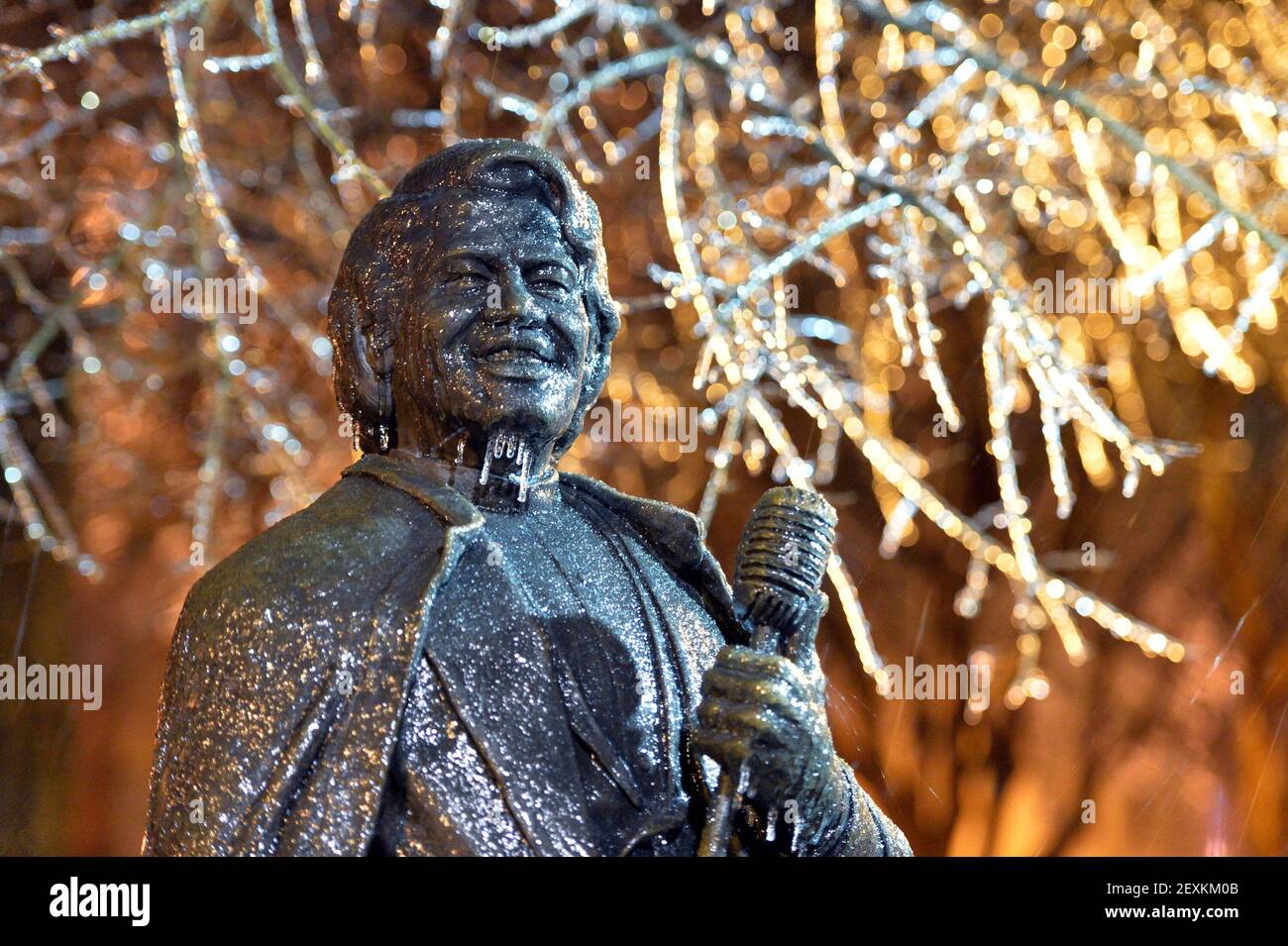 Ice is formed on the life-size bronze statue of James Brown in downtown ...