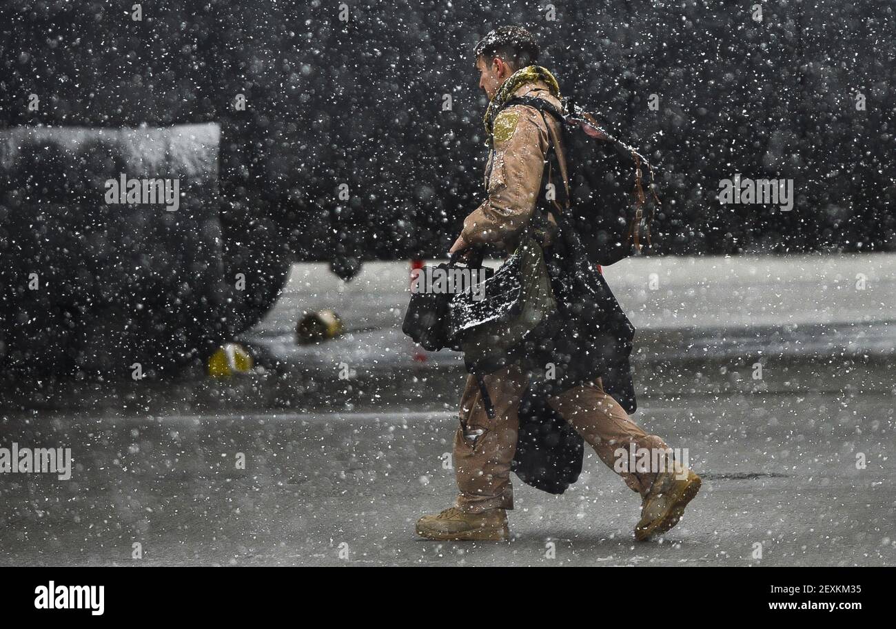 A U.S. Air Force C-130J Super Hercules aircraft pilot prepares to board ...