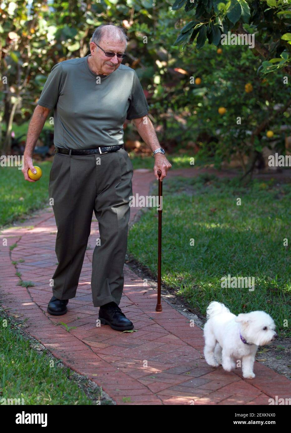 Don Ryce, father of Jimmy Ryce, walks in his backyard garden in Vero ...