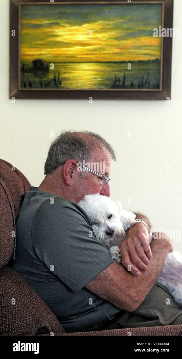Don Ryce, father of Jimmy Ryce, sits with his companion Ginger, in his ...