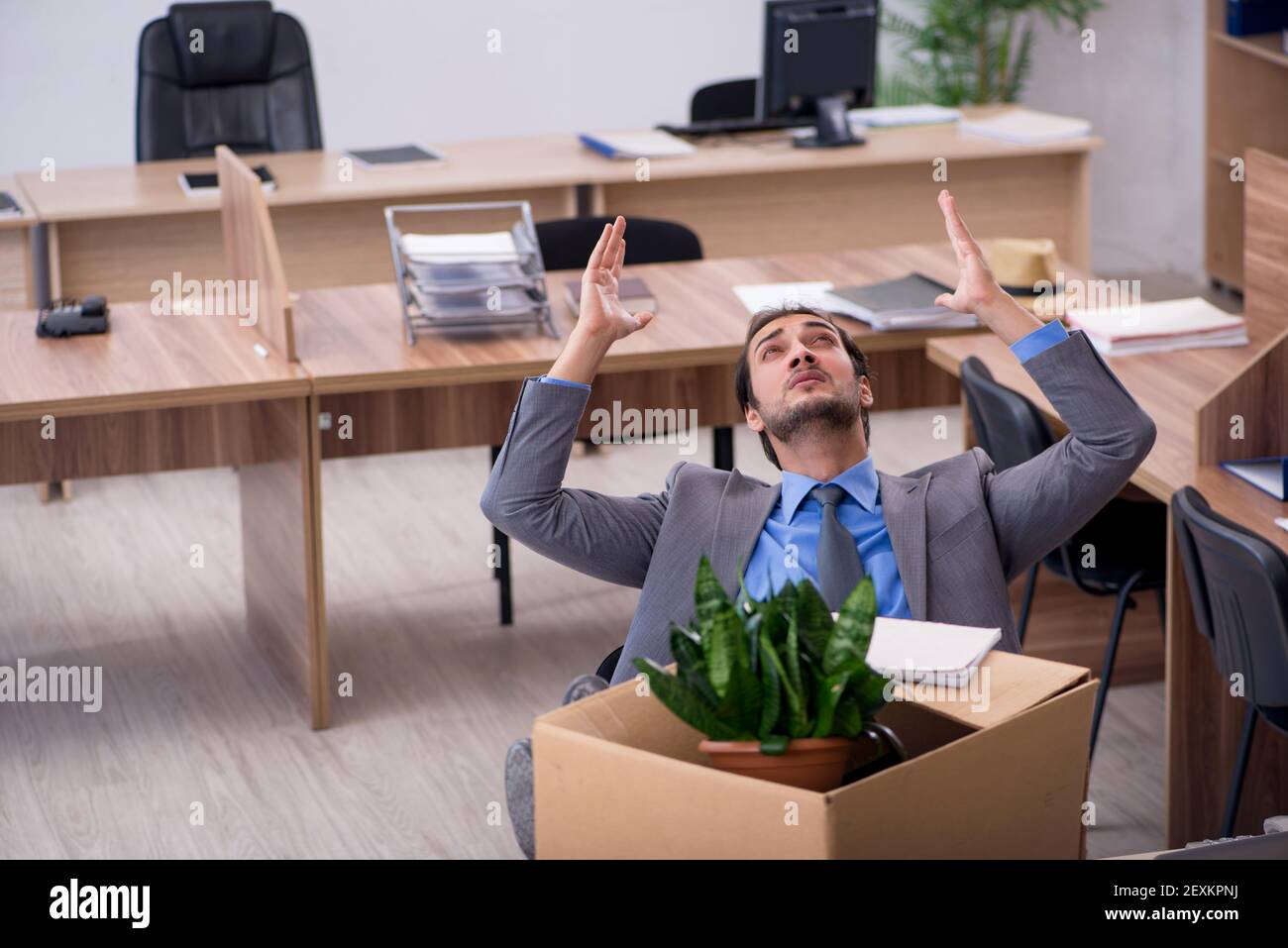 Young employee being fired from his work Stock Photo - Alamy