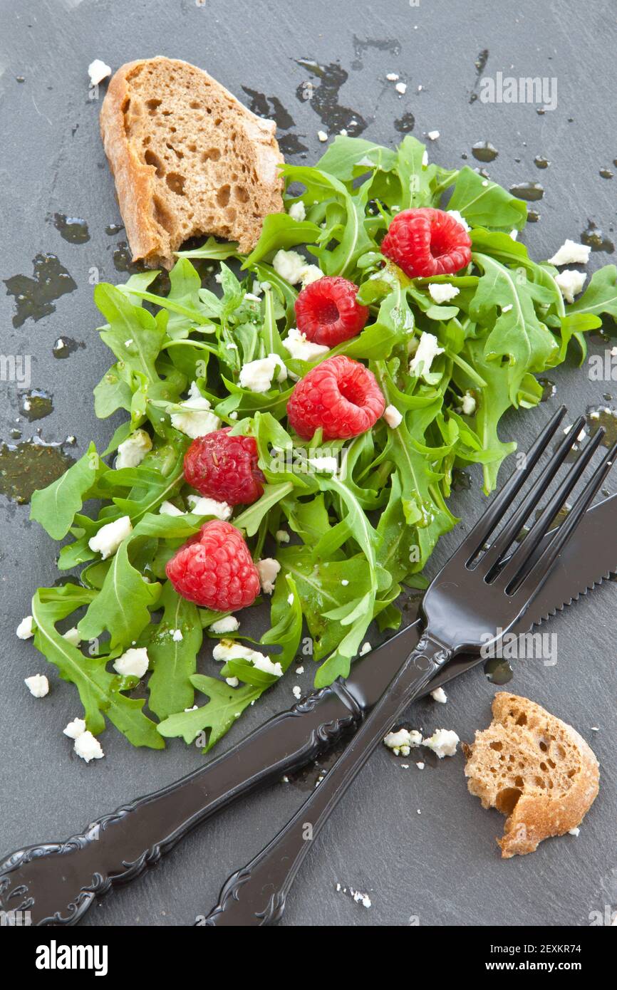 Rocket with feta and raspberries Stock Photo - Alamy