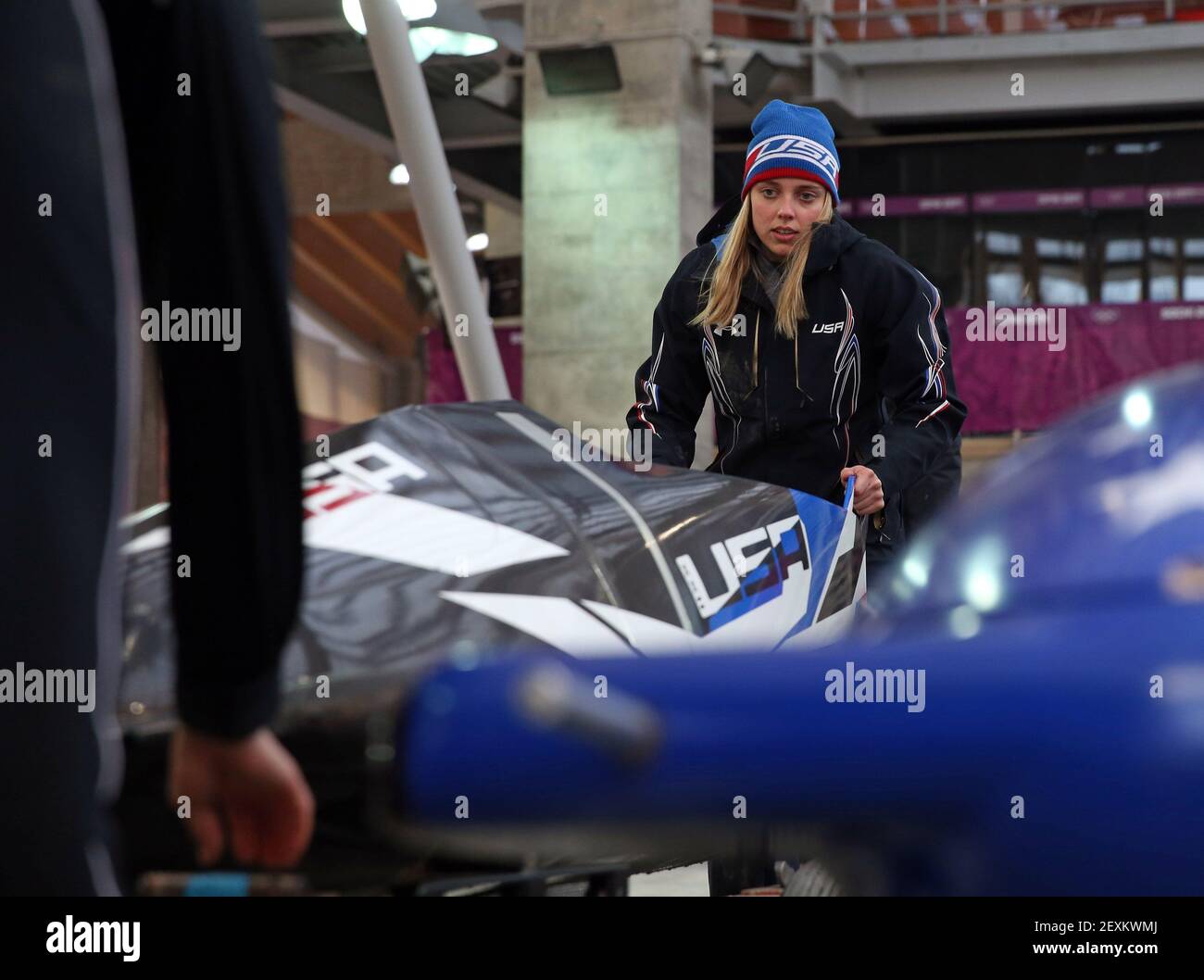USA bobsledding alternate Katie Eberling helps move a sled during ...