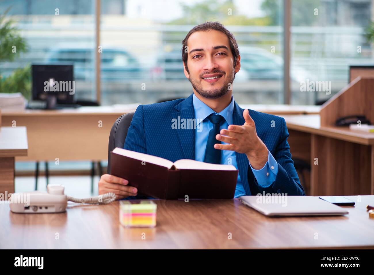 Young man handbook office hi-res stock photography and images - Alamy