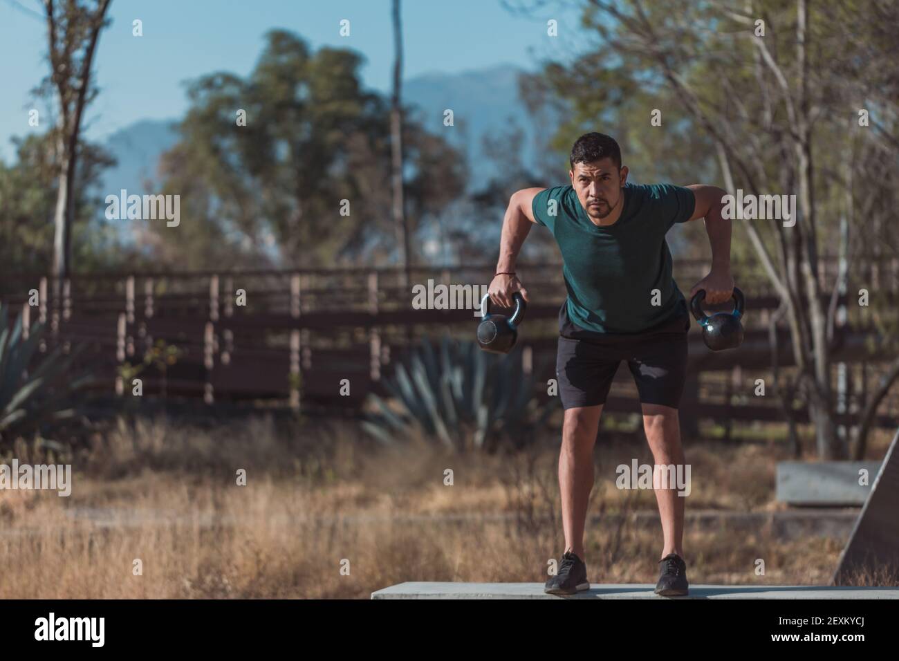 Muscular guy lifting weights hi-res stock photography and images - Alamy