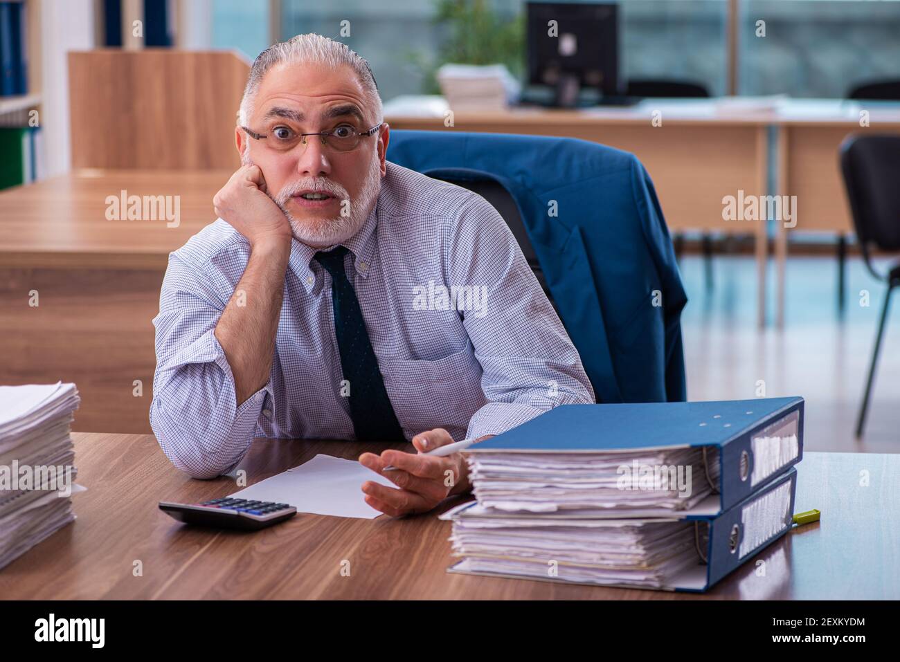 Old employee working in the office Stock Photo - Alamy