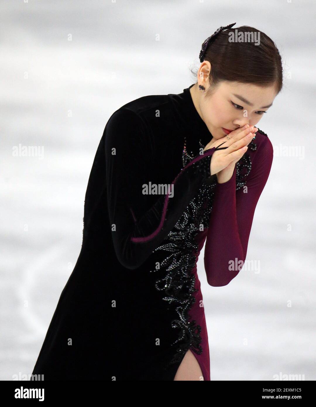 Yuna Kim of South Korea leaves the ice after her silver medal ...