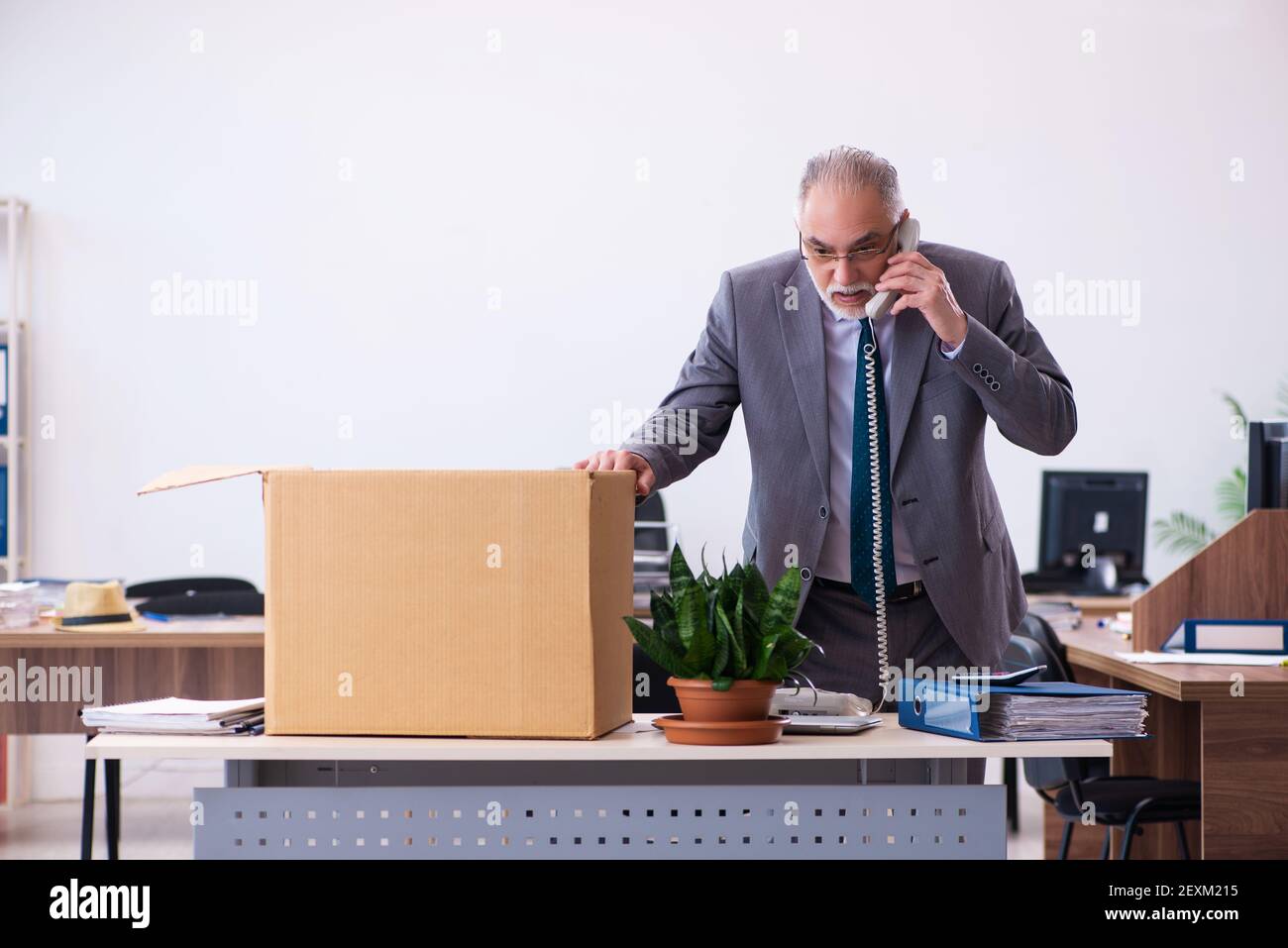Old employee being fired from his work Stock Photo - Alamy