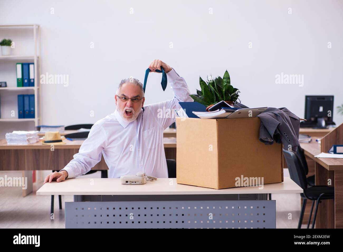 Old employee being fired from his work Stock Photo - Alamy