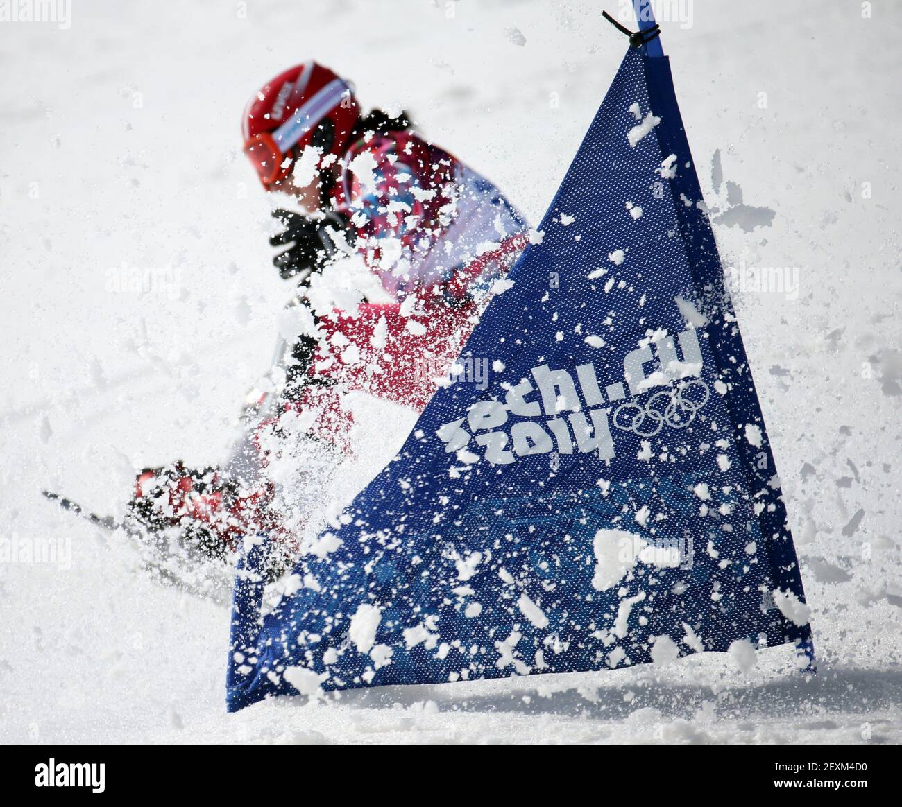 Snowboarders race during parallel slalom at the Rosa Khutor Extreme ...