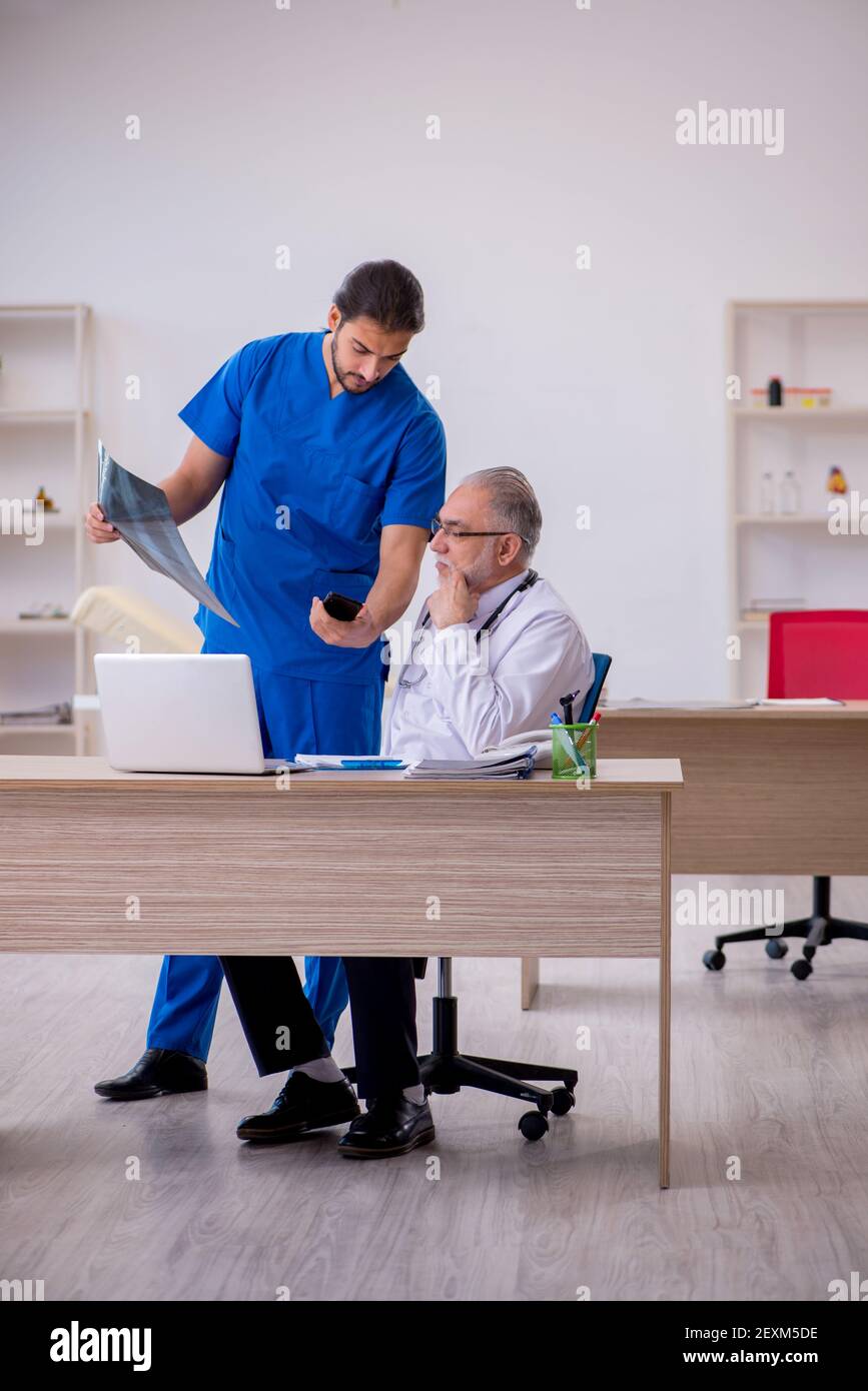 Two doctors working in the hospital Stock Photo - Alamy