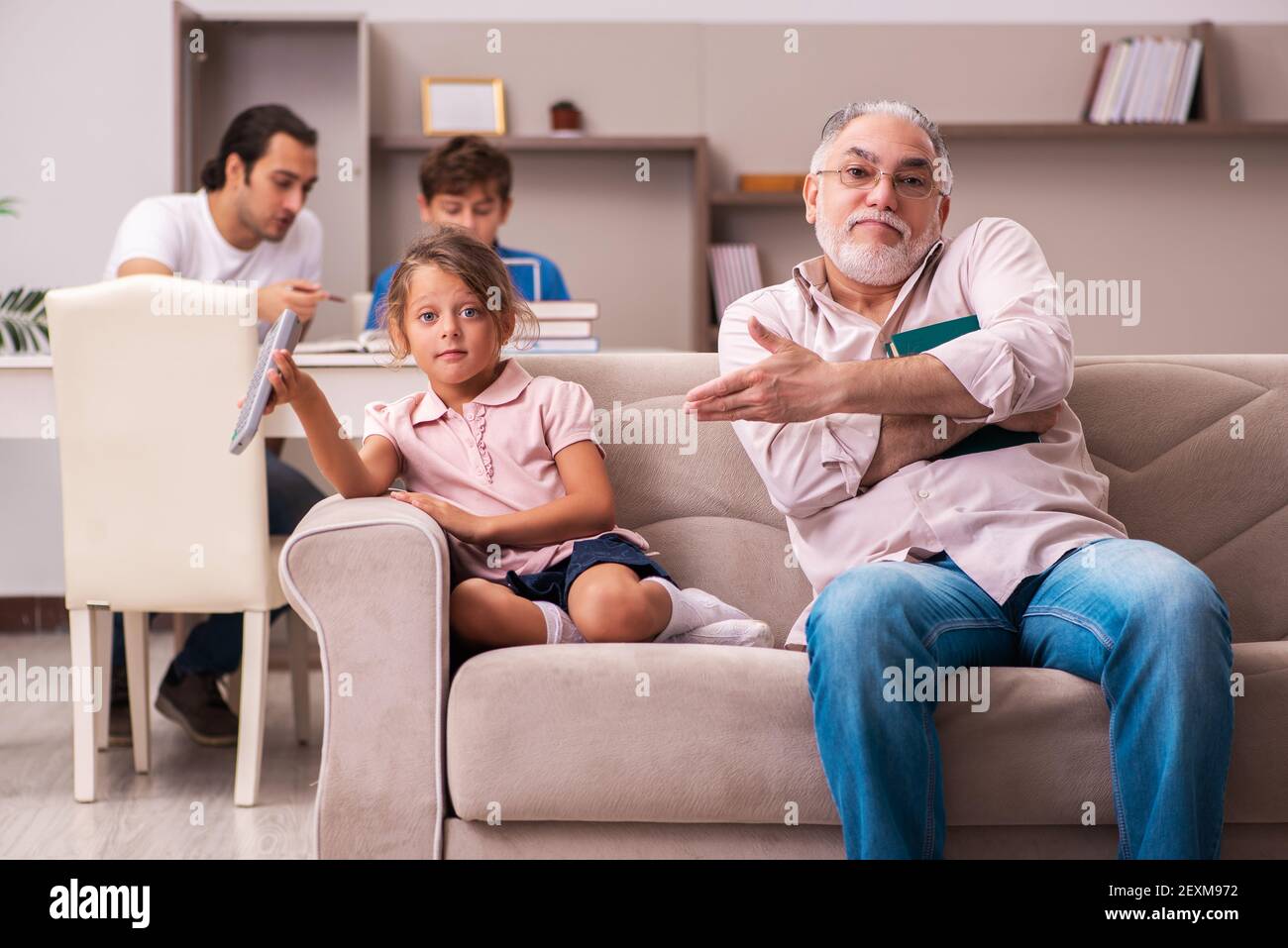 Three generations at home in early development concept Stock Photo - Alamy