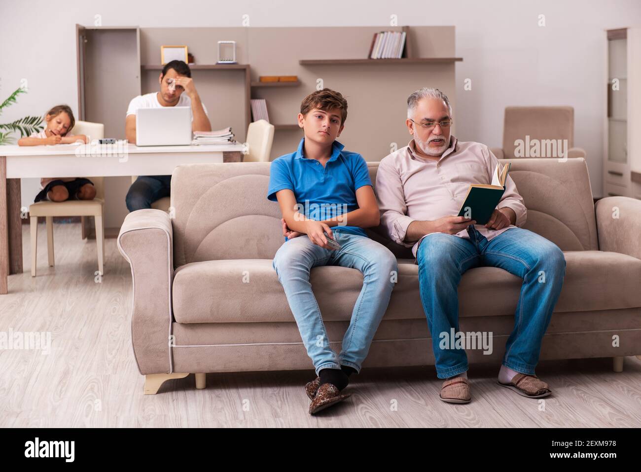 Three generations at home in early development concept Stock Photo - Alamy