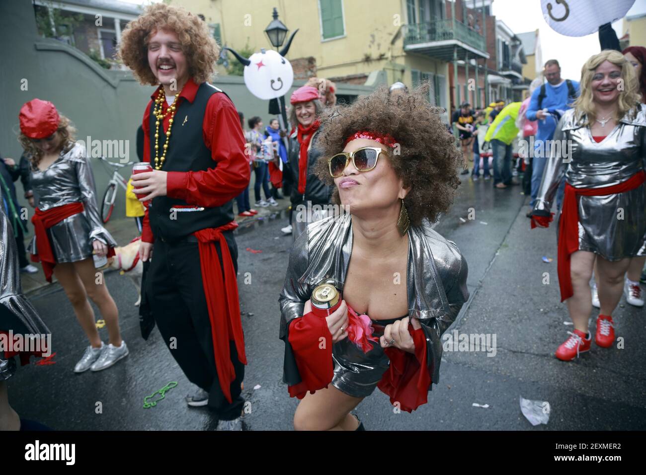 23 Feb 2014. New Orleans, Louisiana. Sharon Berry walks the wet and ...