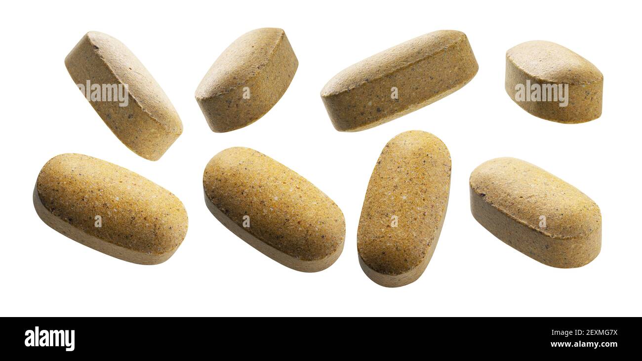 A set of yellow tablets. Isolated on a white background Stock Photo - Alamy