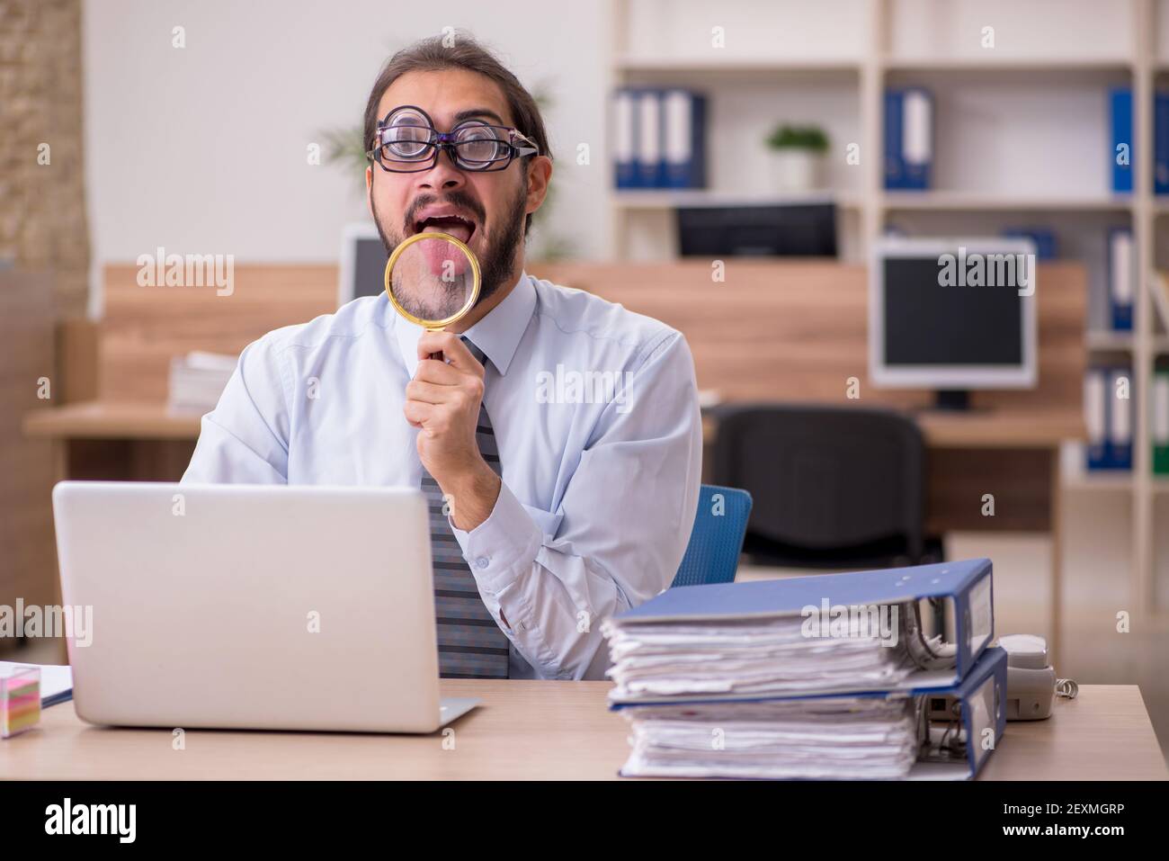 Office work funny young magnifying hi-res stock photography and images ...