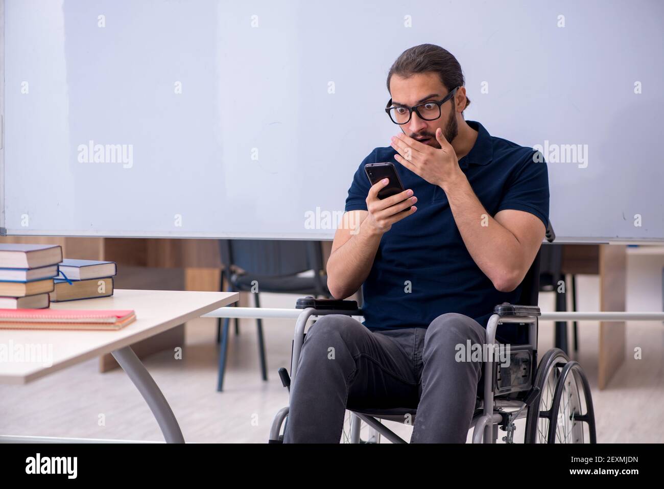 Young handicapped student in the classroom Stock Photo - Alamy