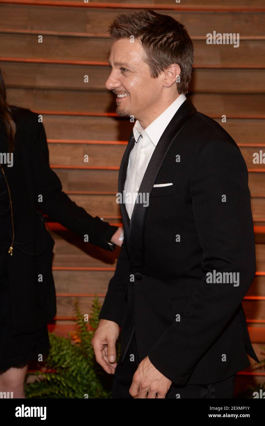 Jeremy Renner arrives at the 2014 Vanity Fair Oscar Party in West ...