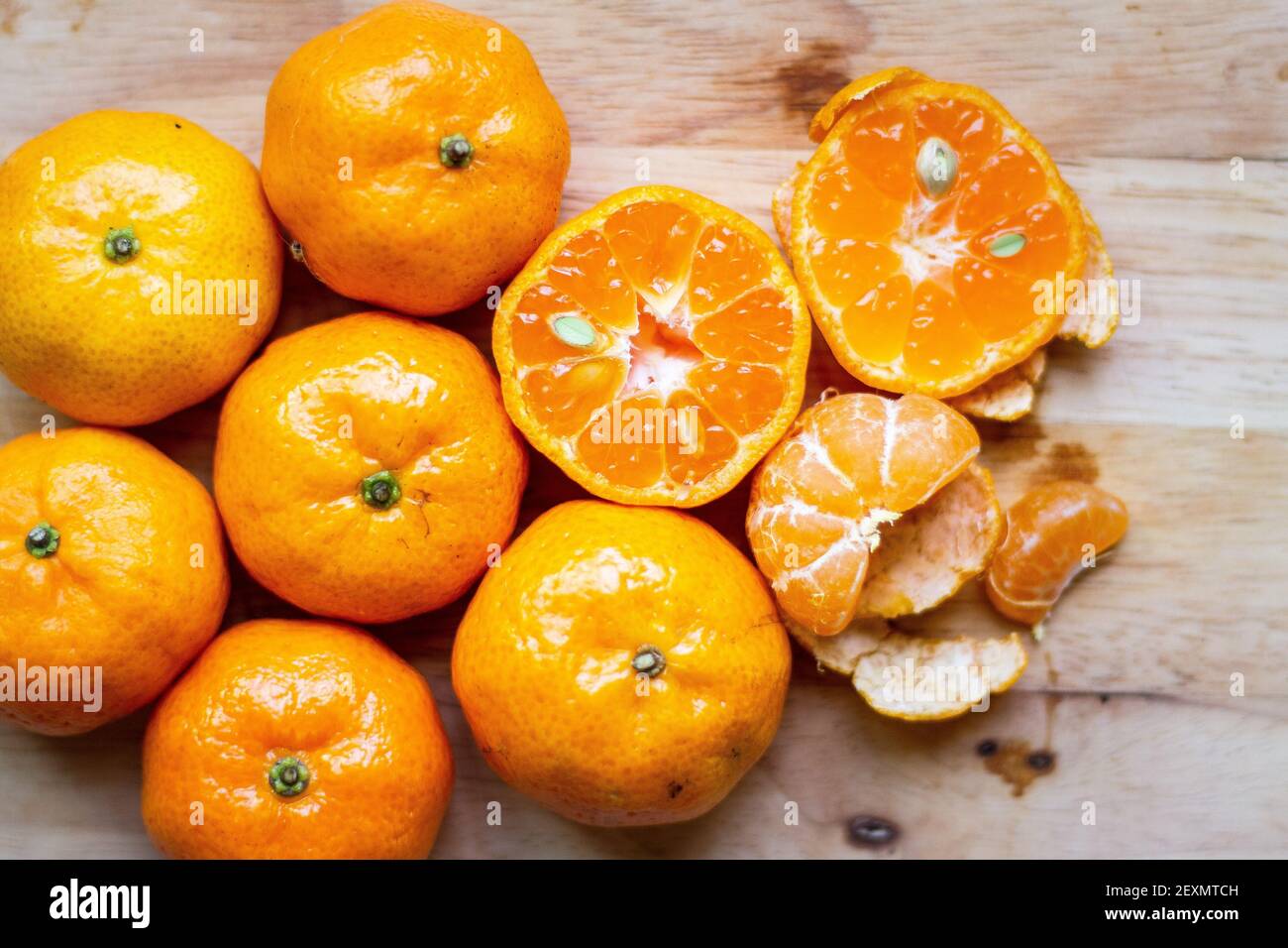 A top view of sliced and peeled tangerines with whole tangerines Stock ...