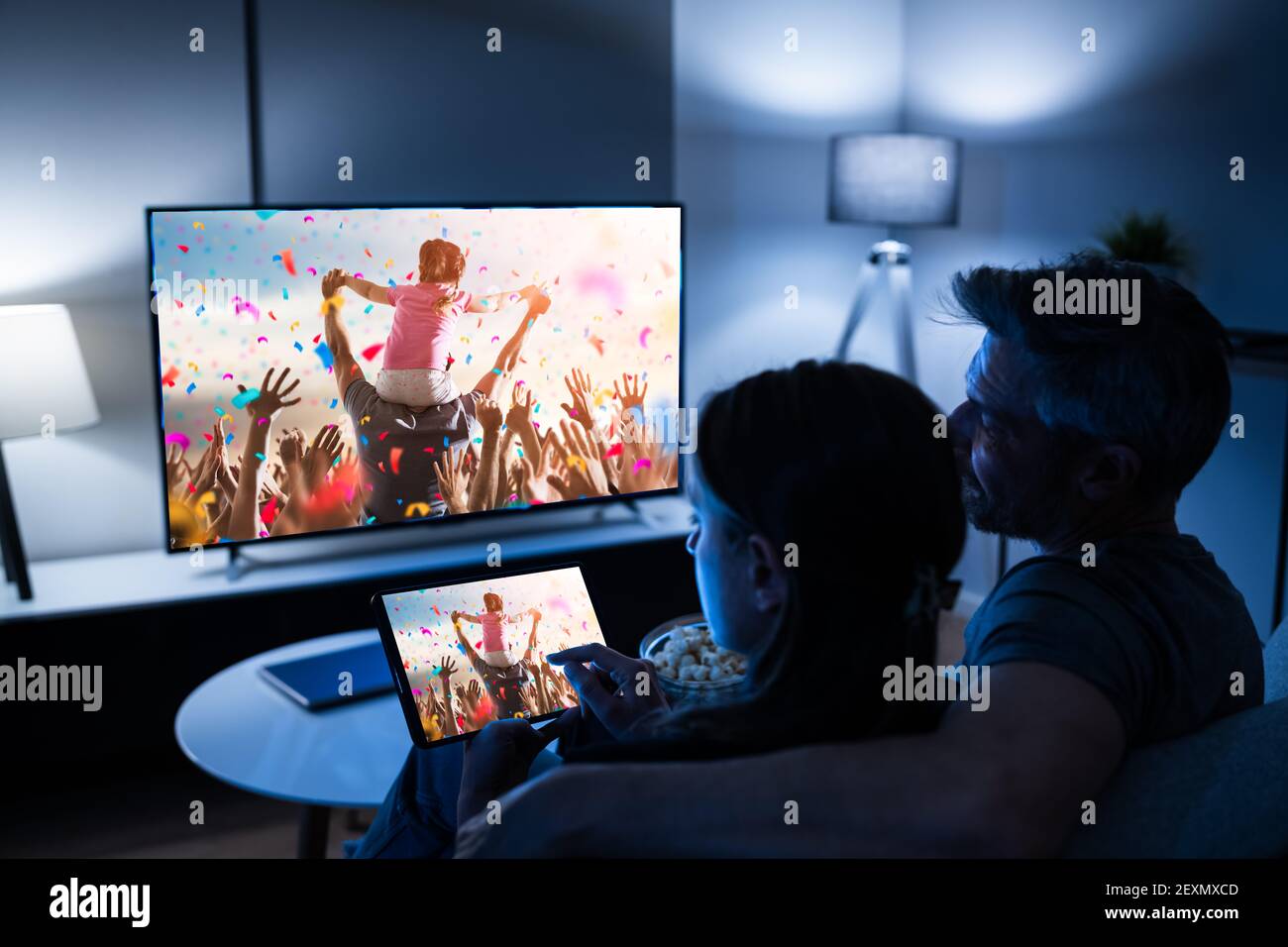 Family Watching TV Through Tablet Television And Movie Streaming Stock ...