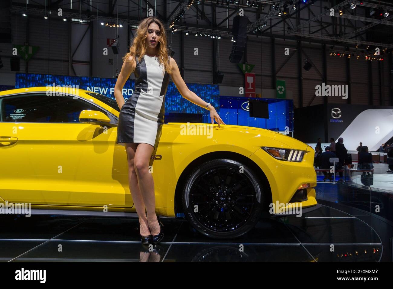 A hostess is seen in front of a Ford Mustang car at the 84th Geneva car ...