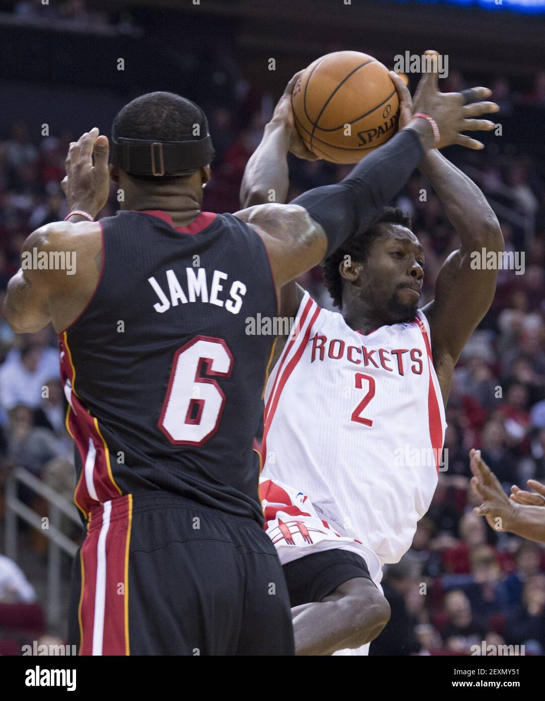 Patrick Beverley (2) of the Houston Rockets drives and passes against ...
