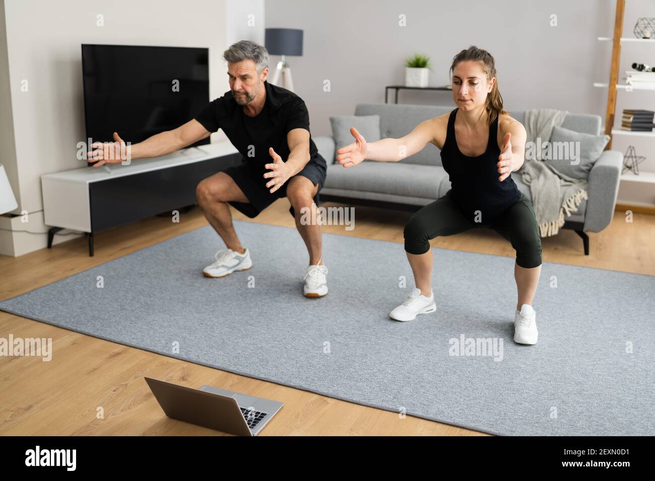 Mature people doing stretching workout hi-res stock photography and ...