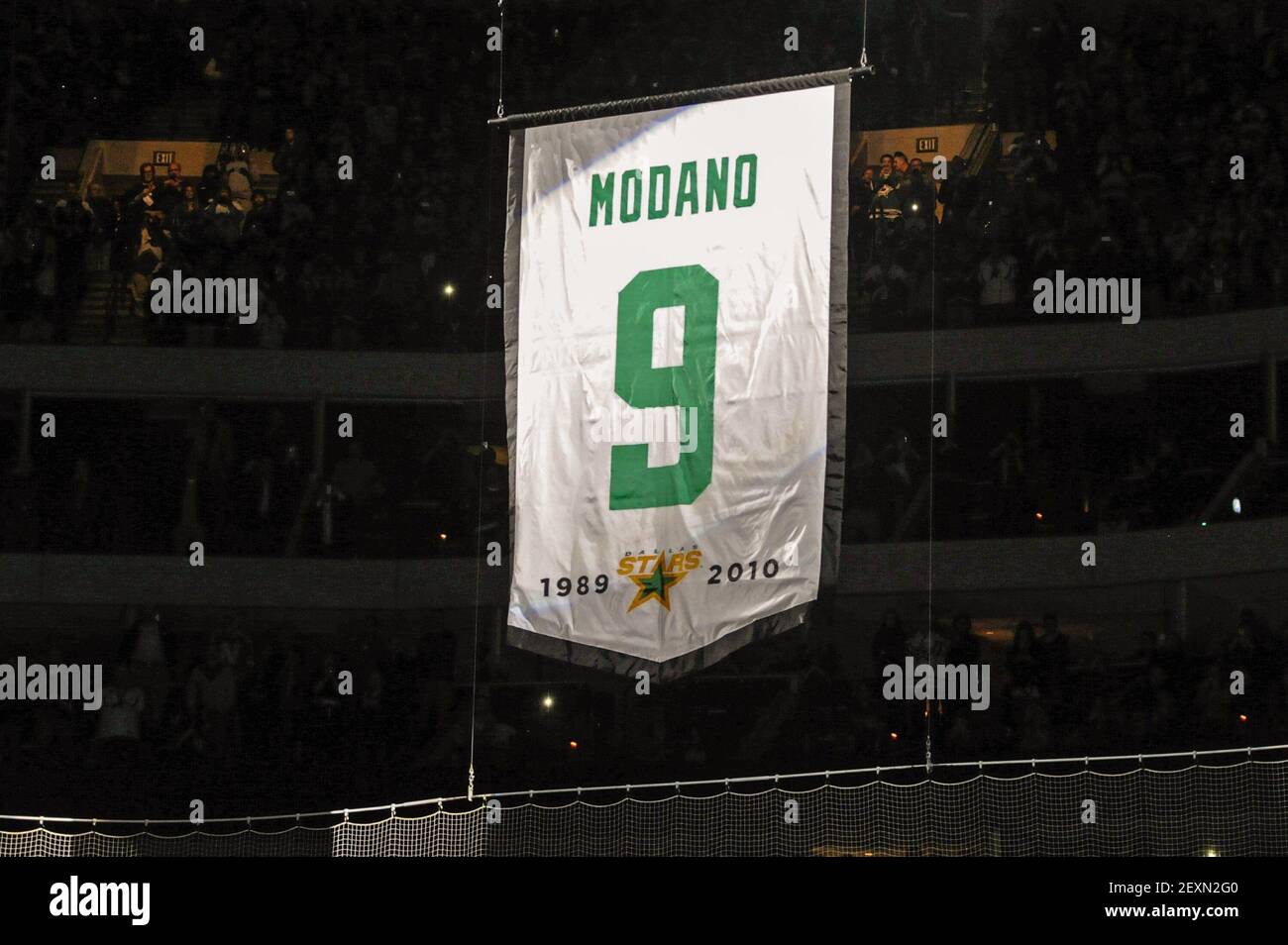 A banner representing the retirement of Mike Modano's No. 9 jersey is ...