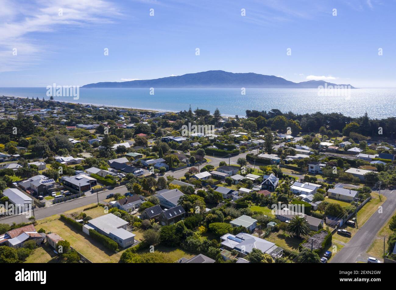 An aerial view of the Waikanae town gleaming under the blue sky in New ...