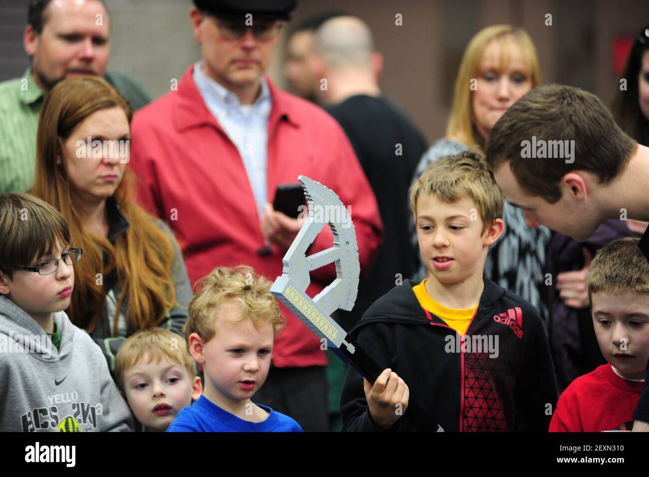An exhibitor allows children to handle a Lego model of Gimli's Walking ...