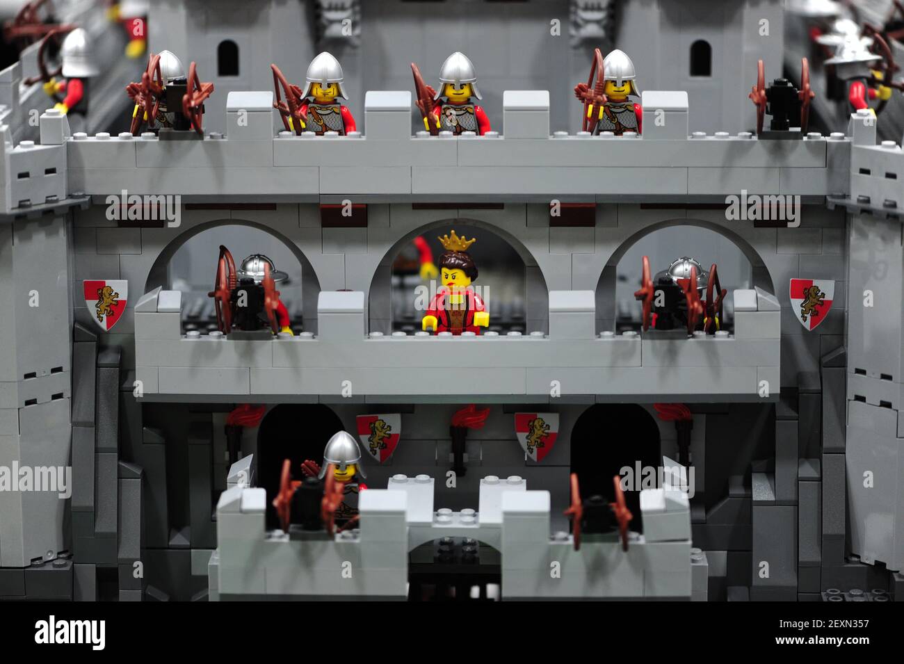 A Queen stands guard over her Lego castle on display at Bricks Cascade ...