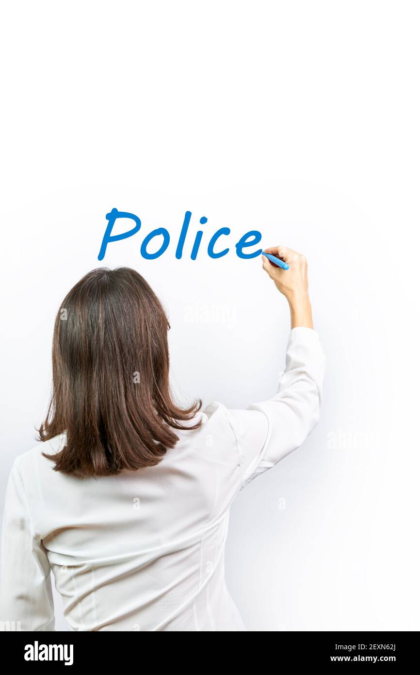Woman writing the word Police on a white background. Safety and ...