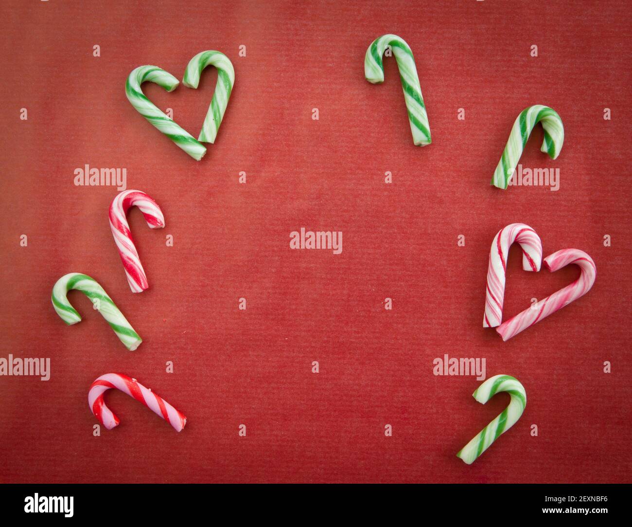 Colorful candy canes on red Stock Photo - Alamy