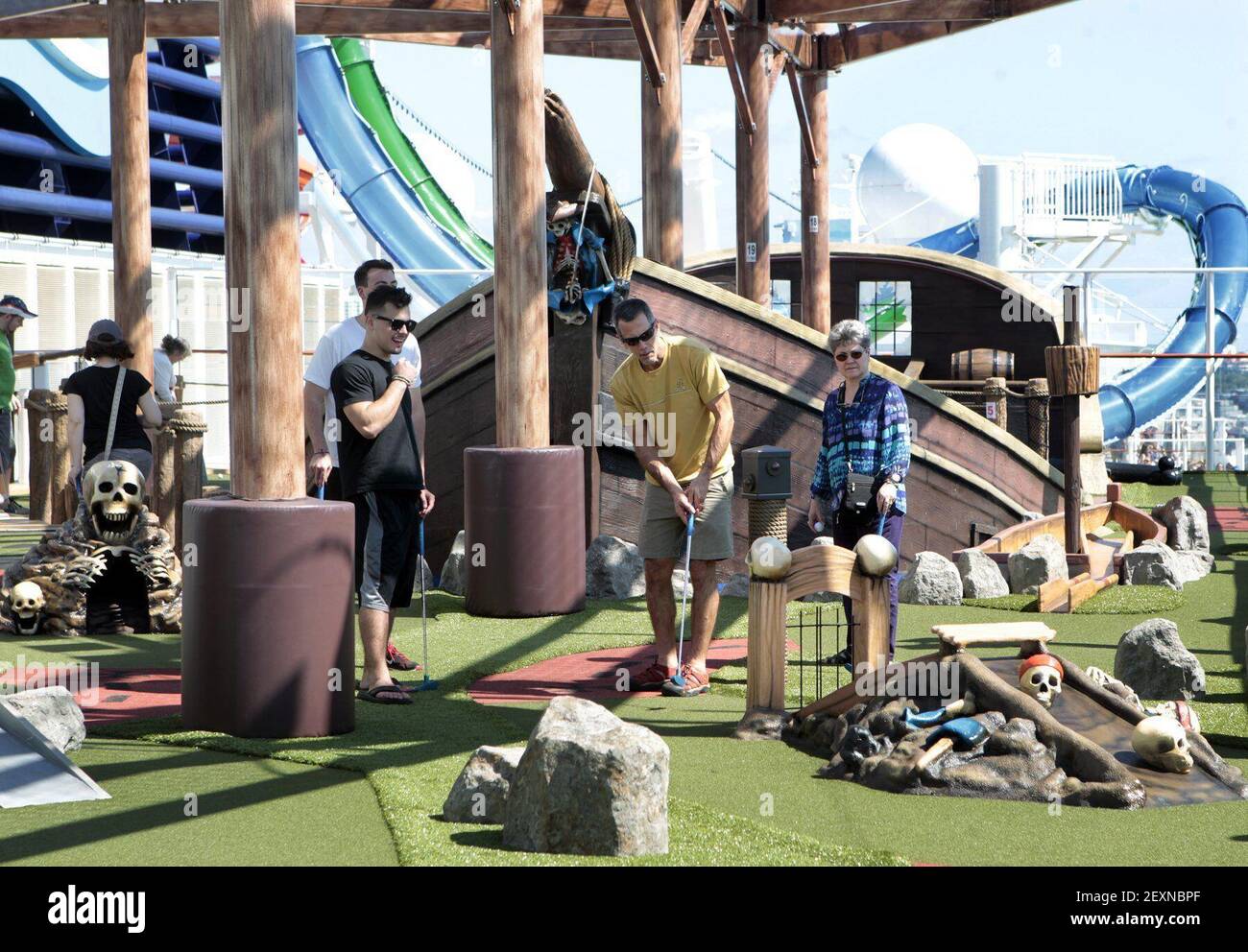 Passengers play mini-golf in the sports complex on board the Norwegian ...