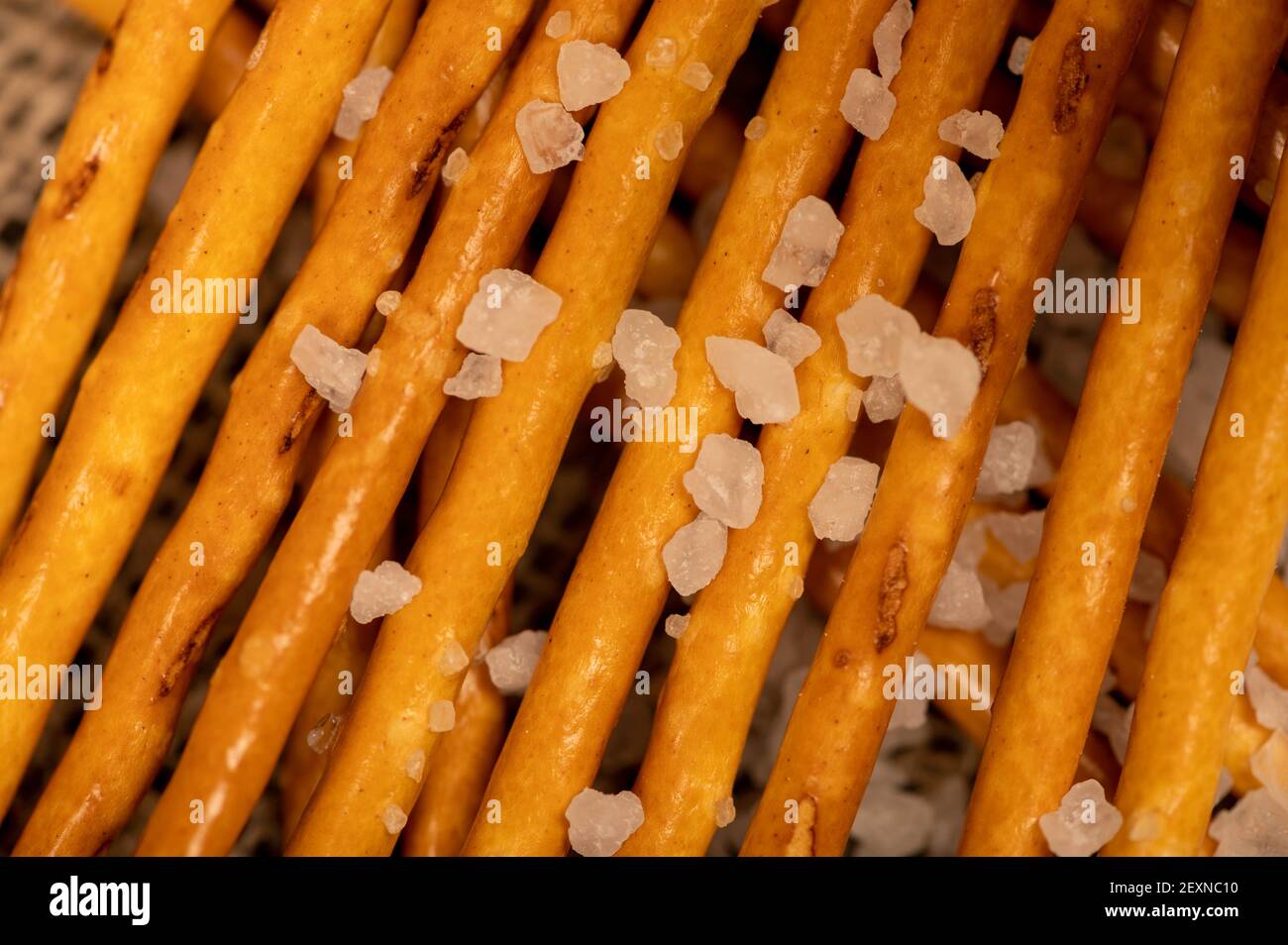 Salty bread strips spread out delicious snack surface texture. Close-up ...