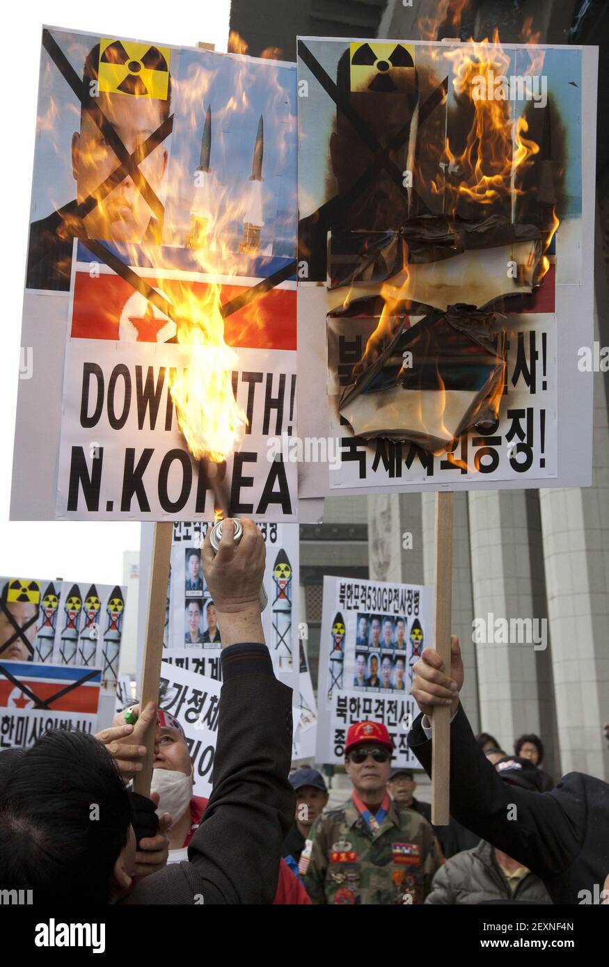 South Korean Police extinguish flames after protesters burned a North ...