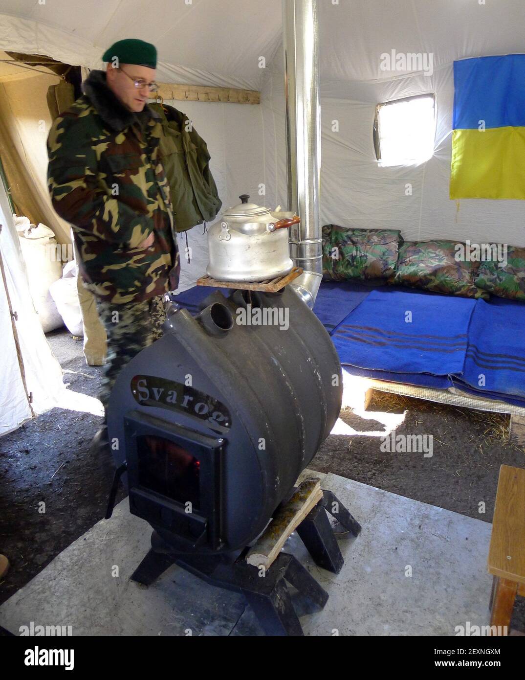 A wood stove heats the officers' quarters at a new Ukrainian base near ...