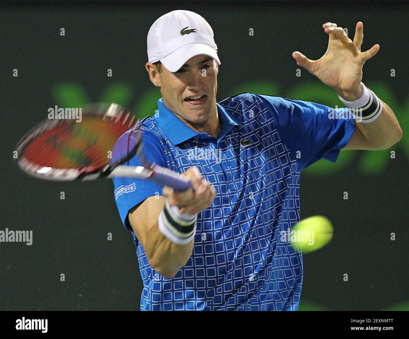 John Isner hits a shot against Nicolas Almagro during the Sony Open ...