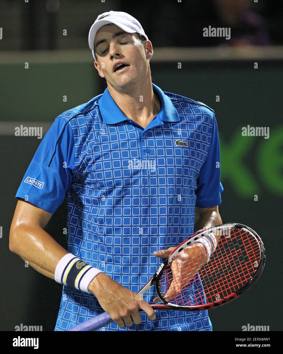 John Isner reacts to a shot against Nicolas Almagro during the Sony ...