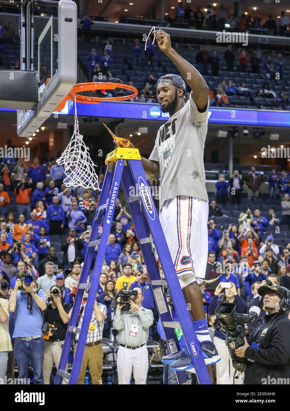 Florida's Patric Young cuts the net after a 62-52 victory against ...