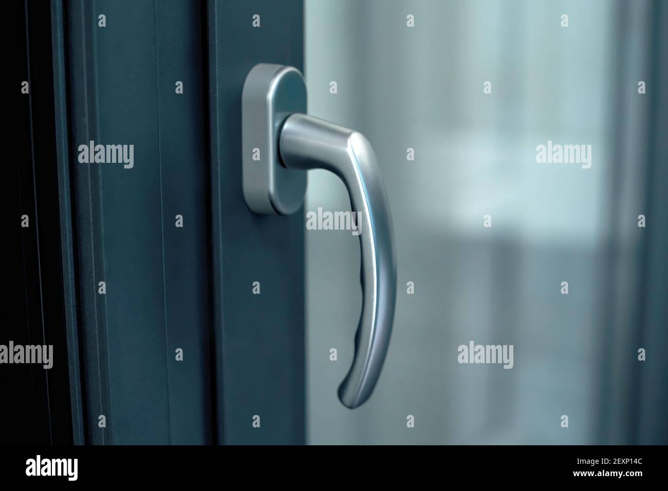 stylish chrome handle on a dark window frame Stock Photo - Alamy